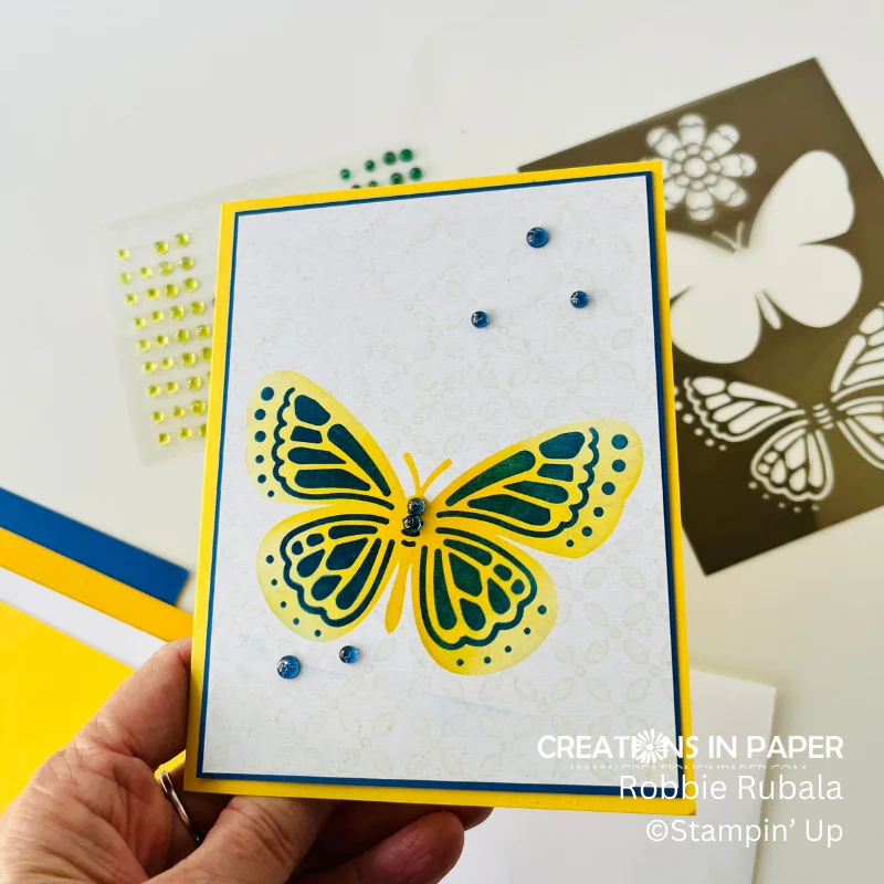 Stenciling on pattern paper - Creations in Paper